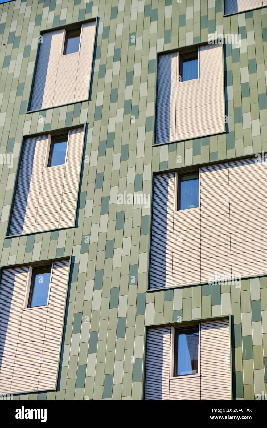 Facade of a modern residential building with green tiles Stock Photo ...