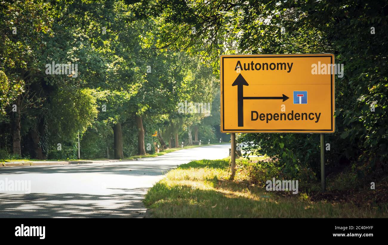 Street Sign the Direction Way to Autonomy versus Dependency Stock Photo ...