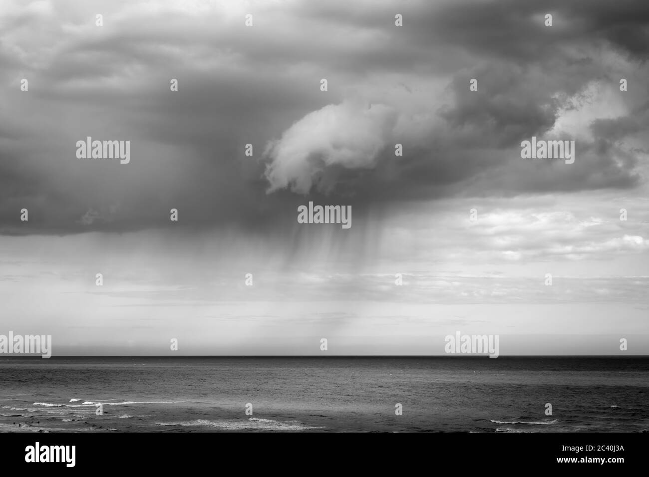 rain clouds hanging over the sea Stock Photo - Alamy