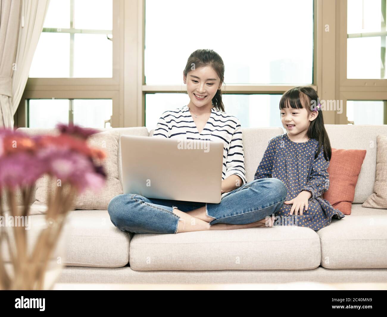 Laptop mother working with child hi-res stock photography and images ...
