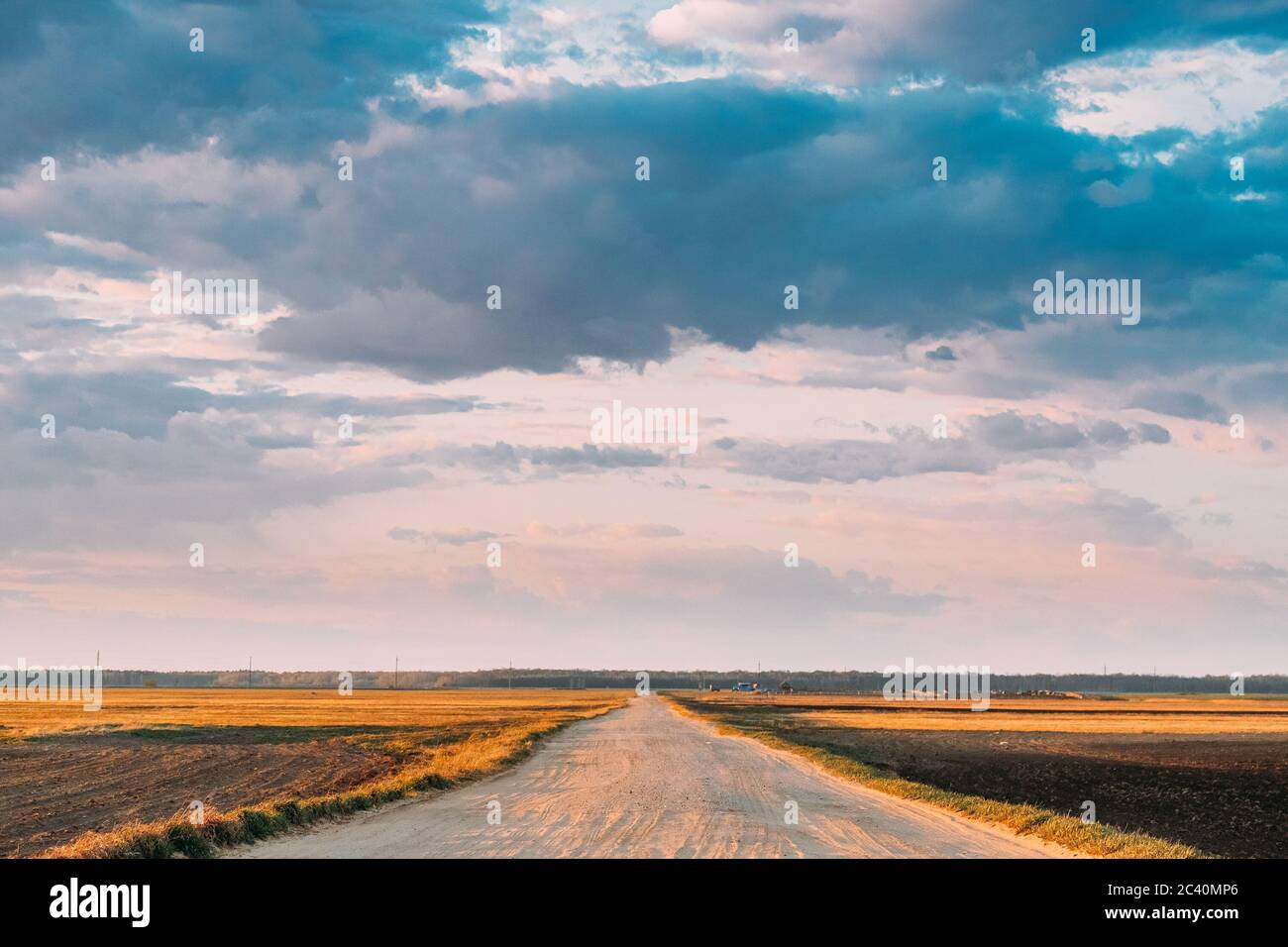 Evening Sky Above Rural Landscape With Country Road Through Spring Soil ...