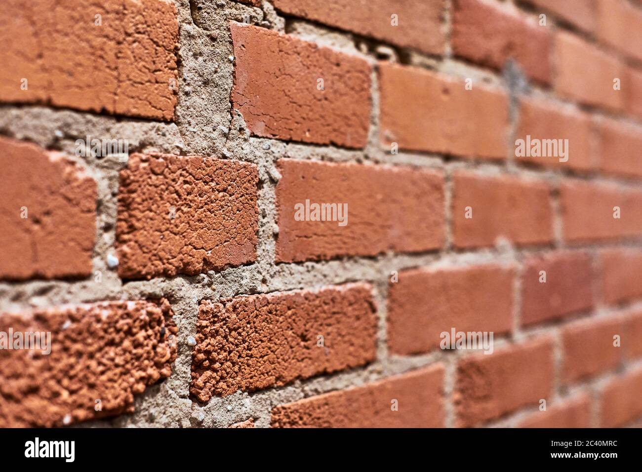 Loft red brick wall, angled view. Polished brick wall in attic interior ...