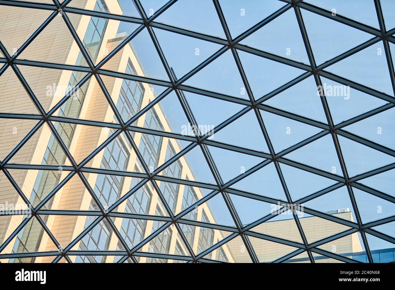 Transparent ceiling in business center. Glass triangle windows. Mesh ...