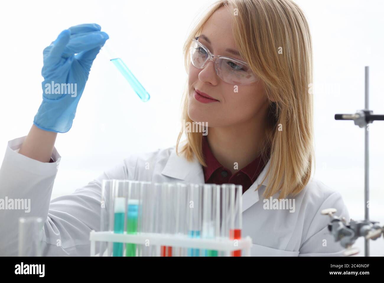 Female laboratory worker holding test tube with poison fluid Stock ...