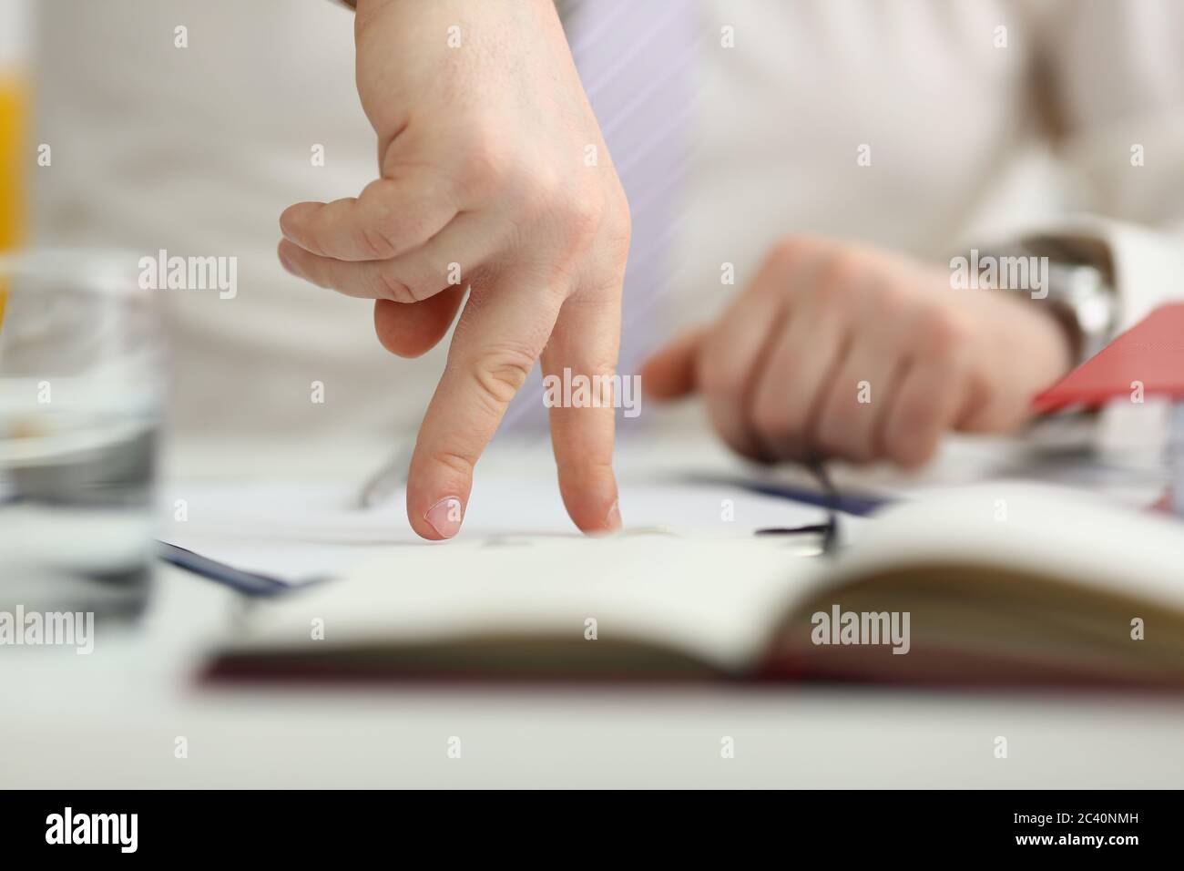 Male hand fingers walking on white table with book Stock Photo - Alamy
