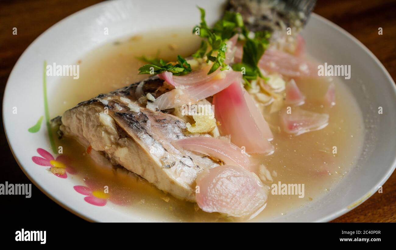 Steamed Rohu fish in Lemon Sauce with red onion and garnished with ...