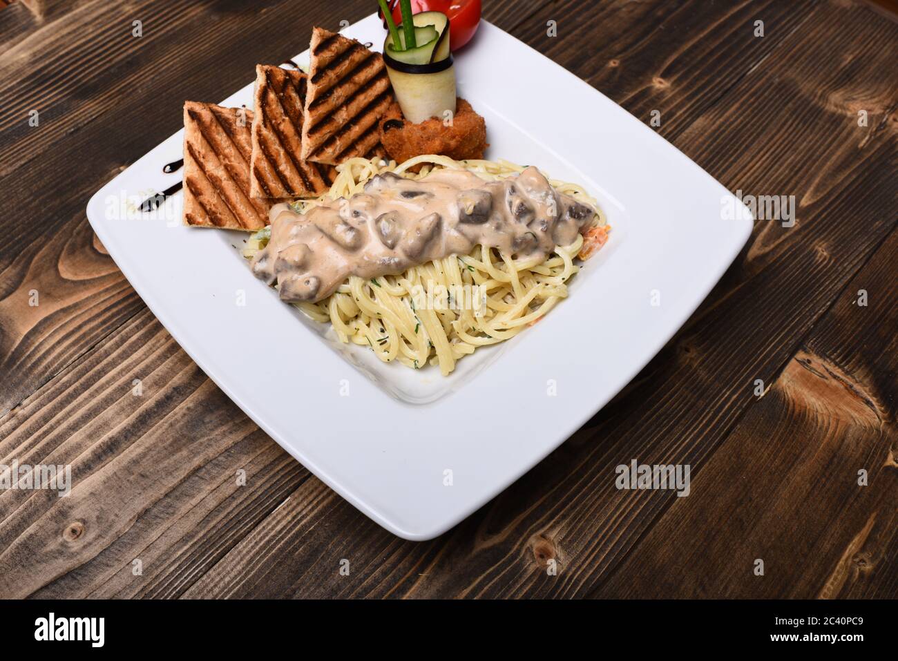 Table served for one in restaurant or cafe. Italian spaghetti with ...