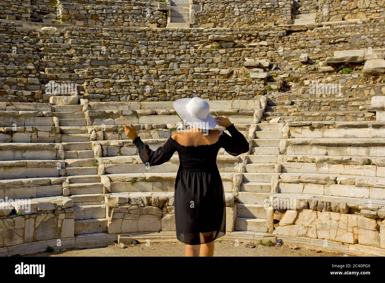 Beautiful young woman in black dress in Ephesus ancient city Stock ...