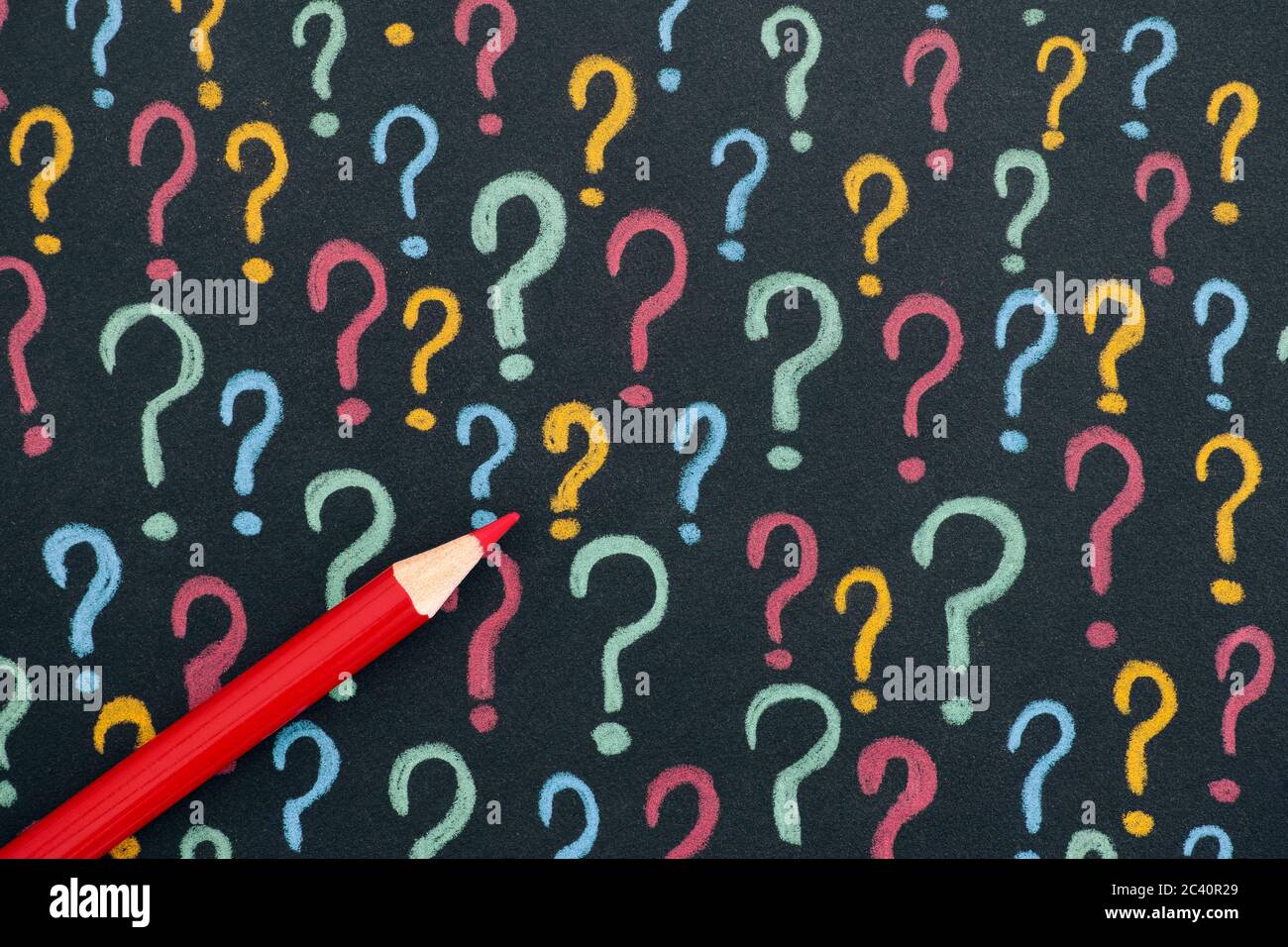 Colorful question marks with pen on a black paper. Close up Stock Photo ...