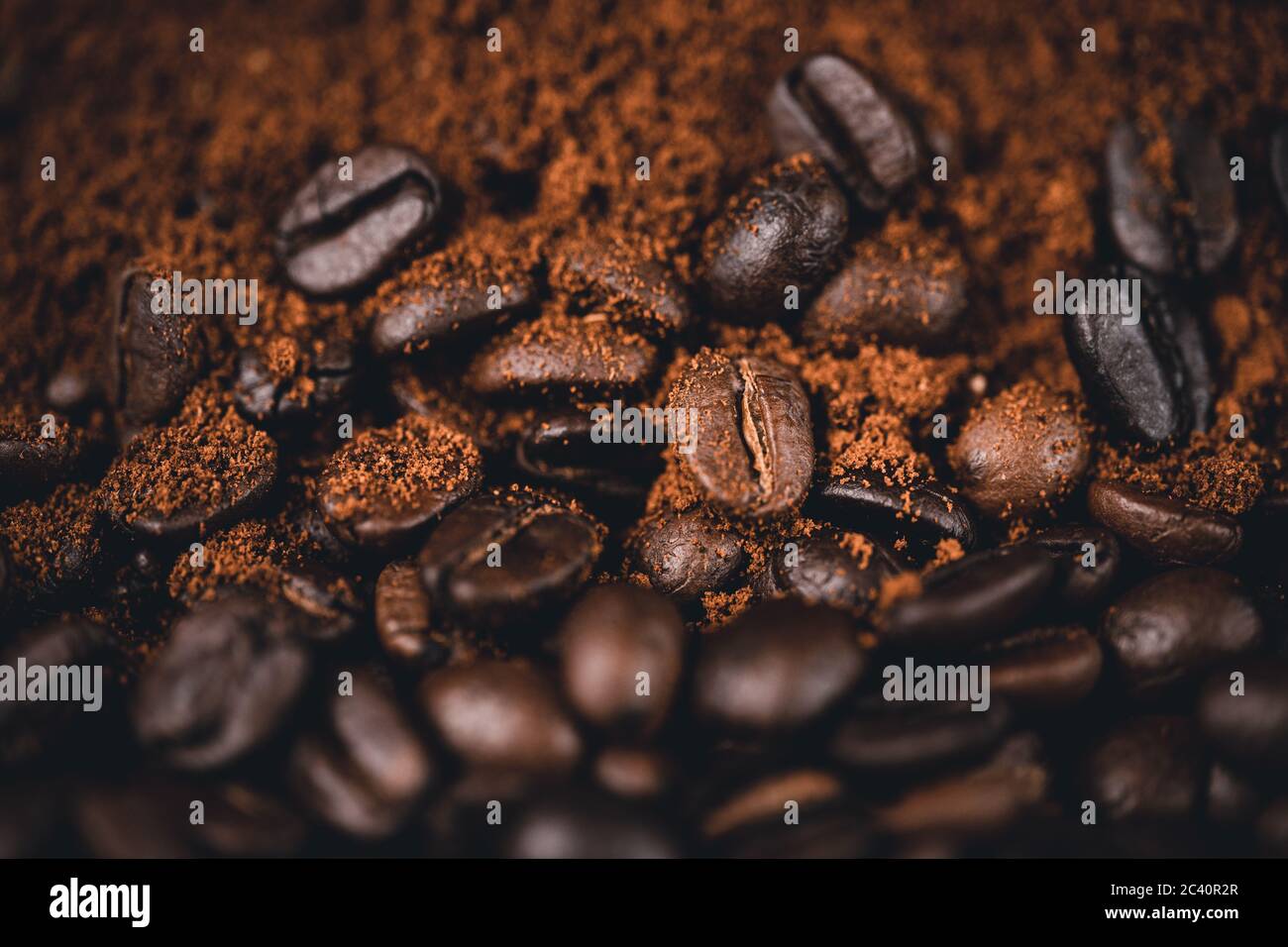 Ground coffee on the background, roasted coffee beans Stock Photo - Alamy
