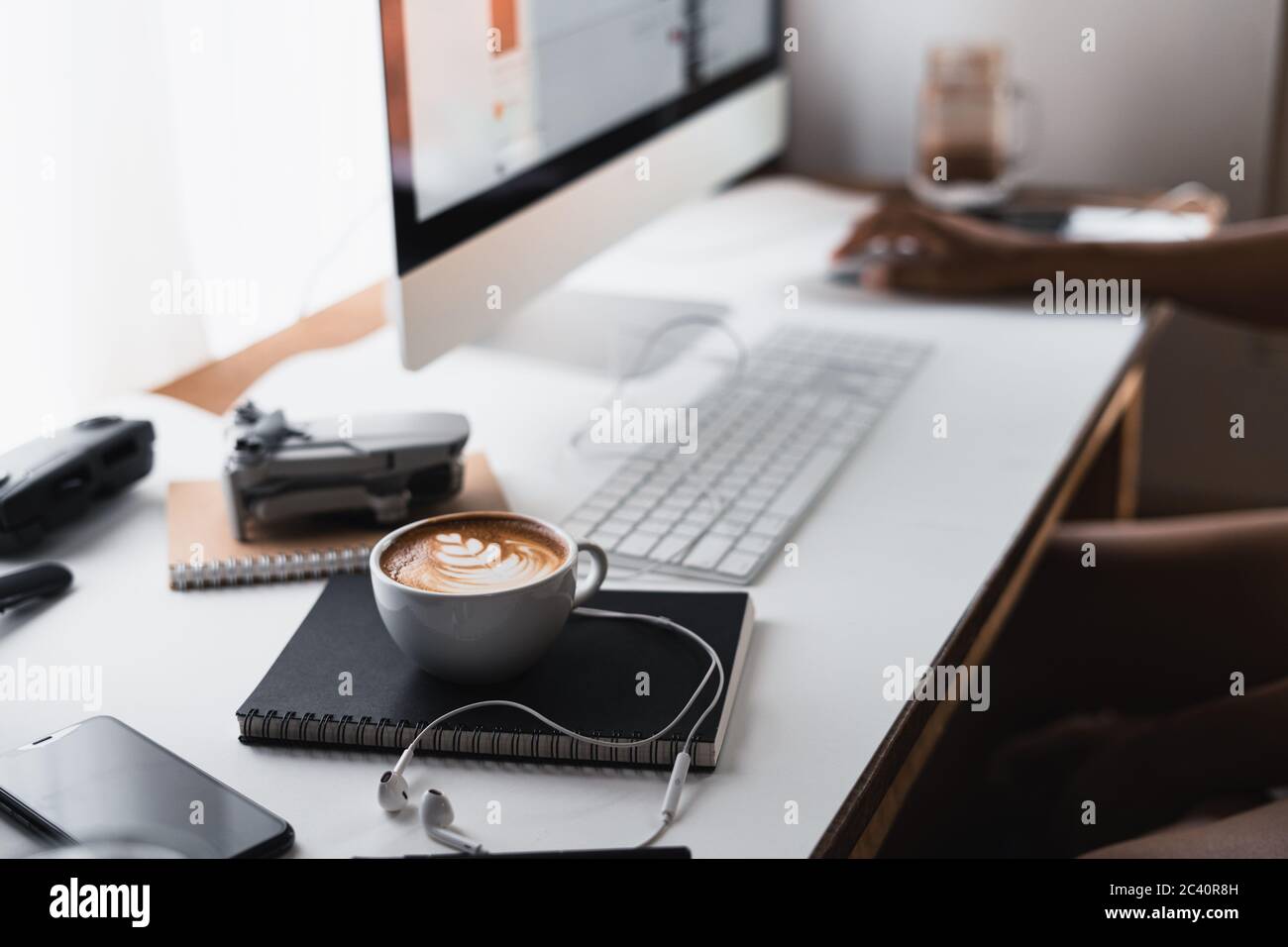 Latte coffee in a cup at the computer desk,Coffee on the desk at home ...