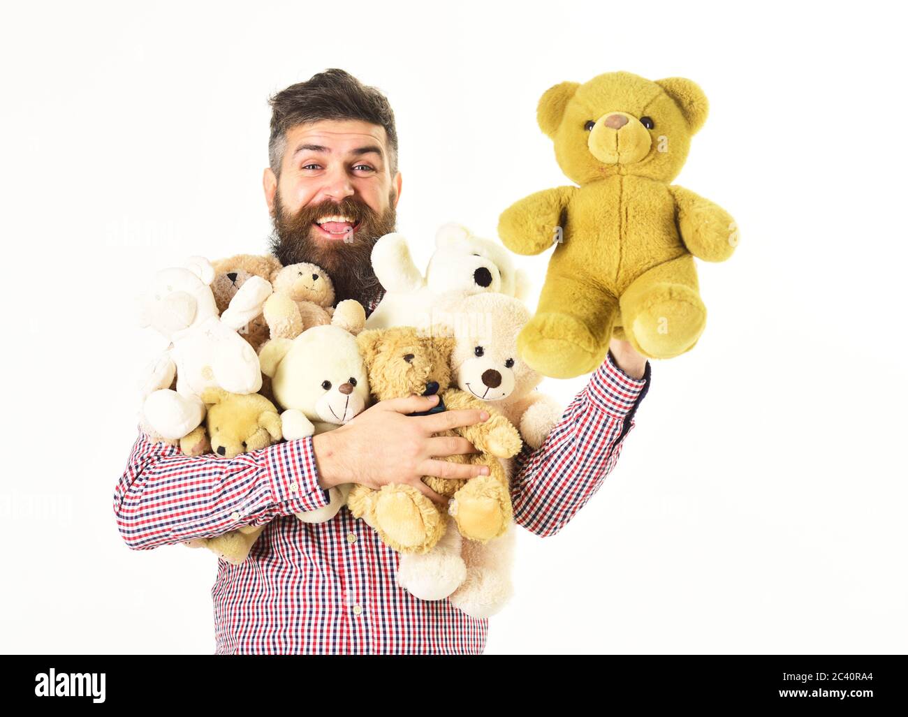 Hipster feels like child with pile of toys. Macho with beard hold plush ...