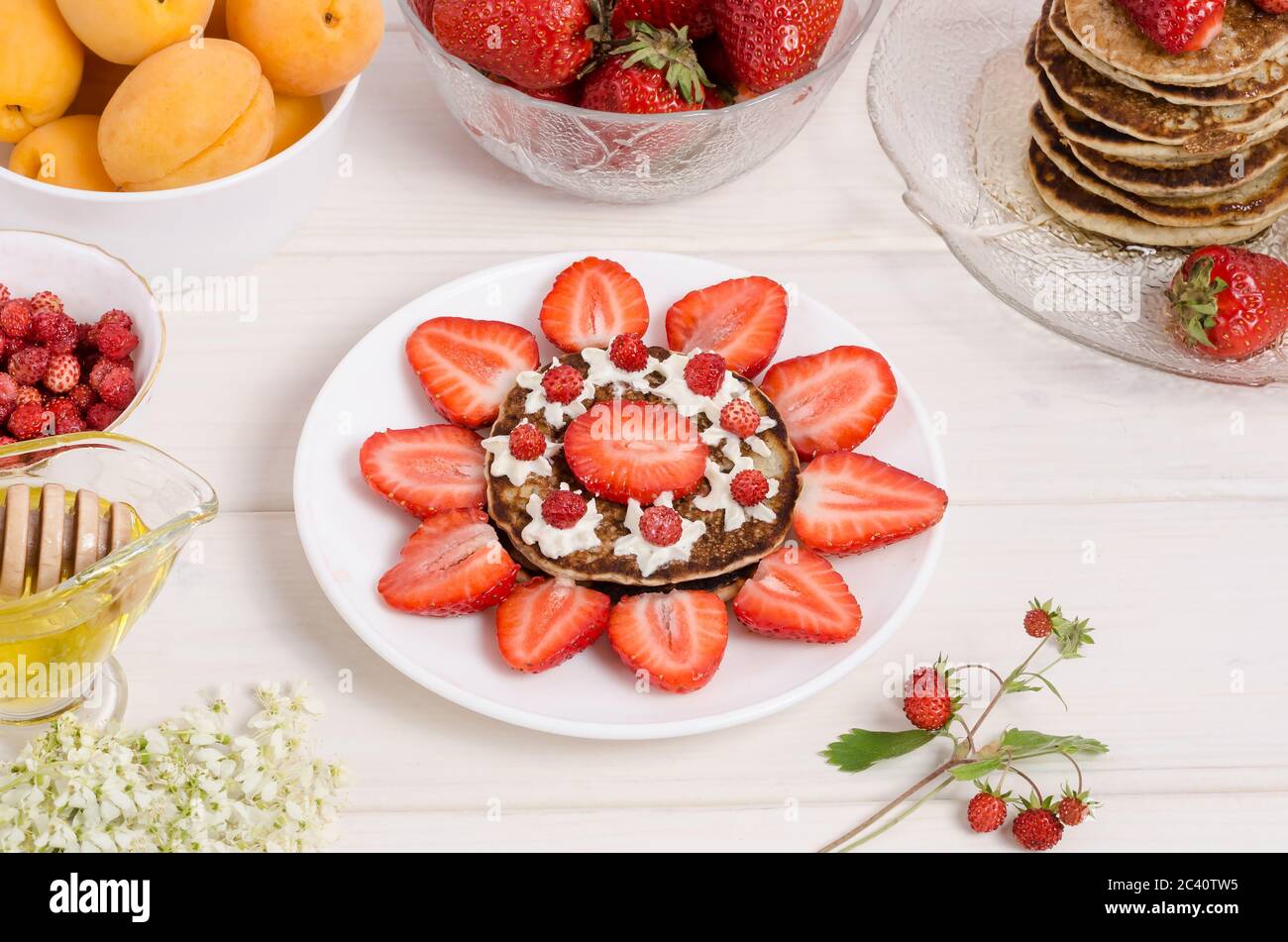 Decoration of pancakes for a children's breakfast in the form of a sun ...