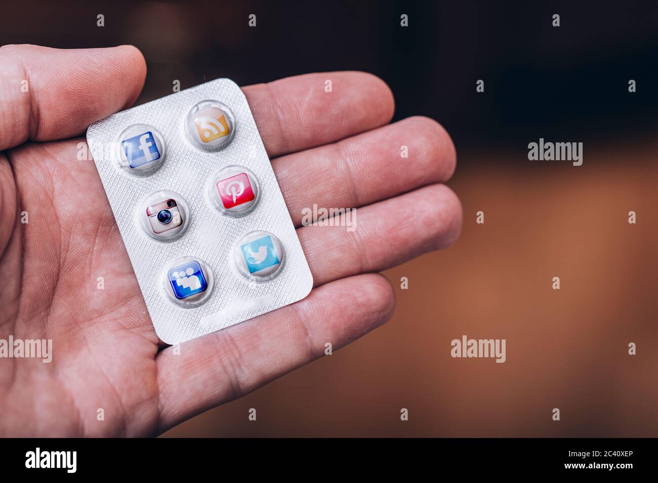 Social media or network addiction concept. Pills with logo of the most ...