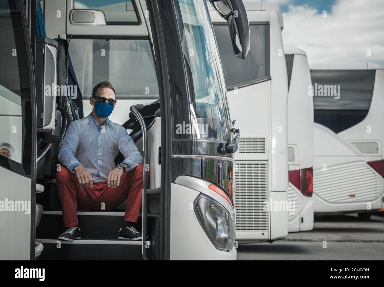 Caucasian Bus Driver in His 40s Seating on the Coach Bus Entry Stair ...