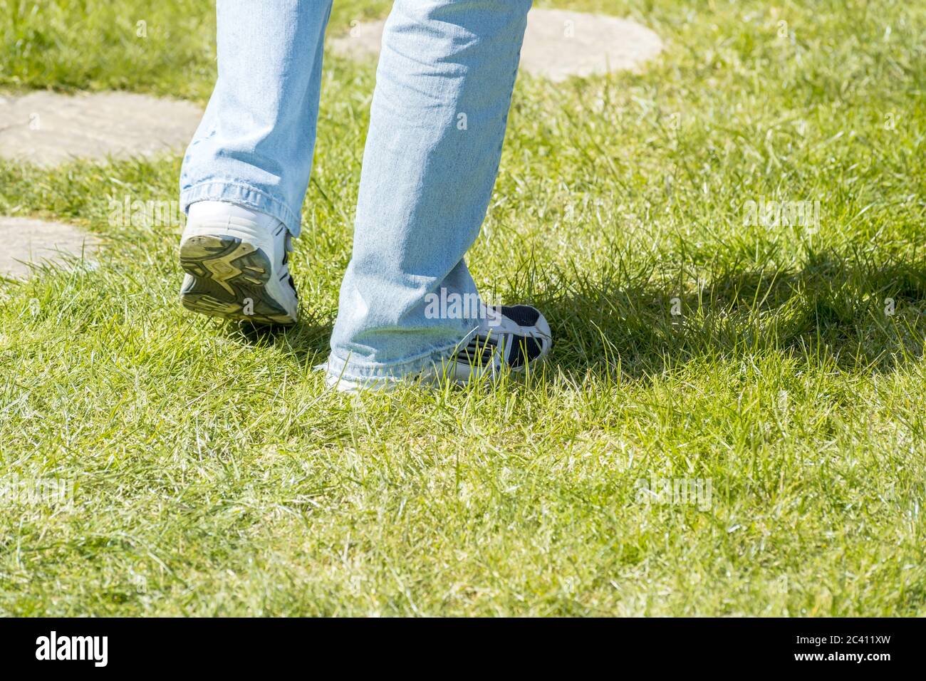 Adult walk on the garden during spring Stock Photo - Alamy