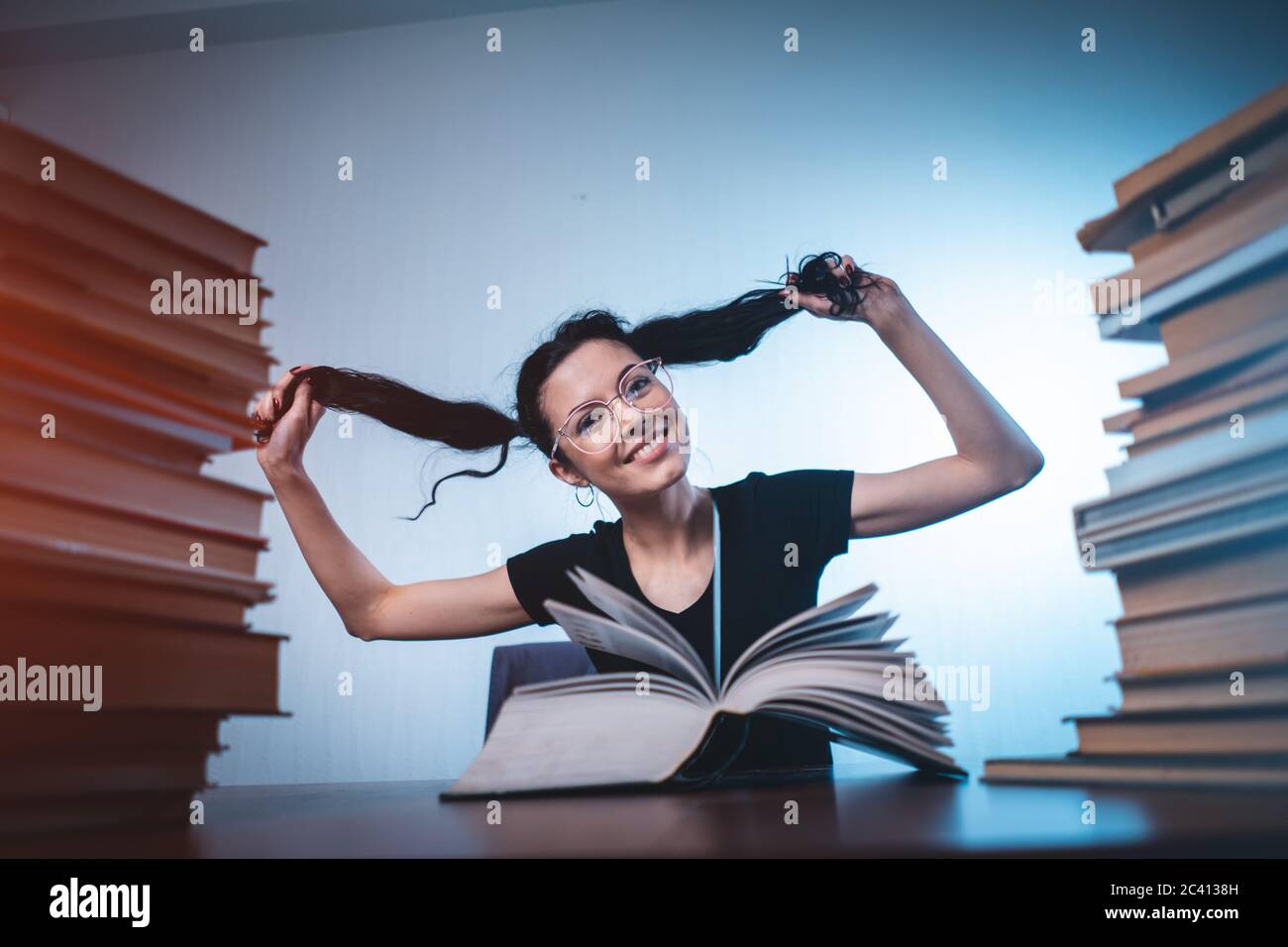 young girl reading very interesting book at home Stock Photo - Alamy