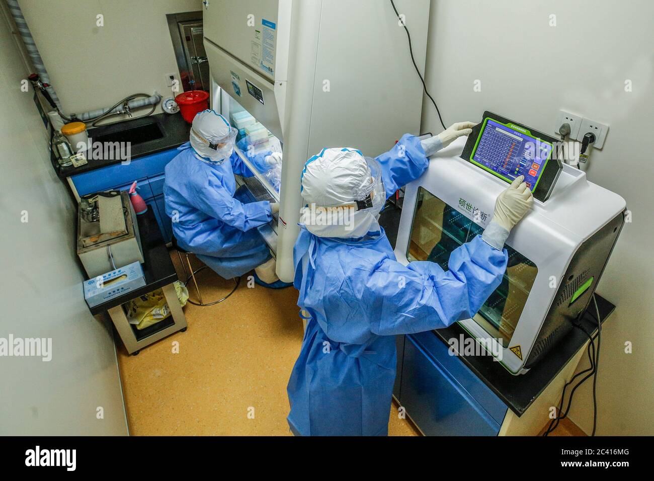 Beijing, China. 23rd June, 2020. Medical workers work at the polymerase ...