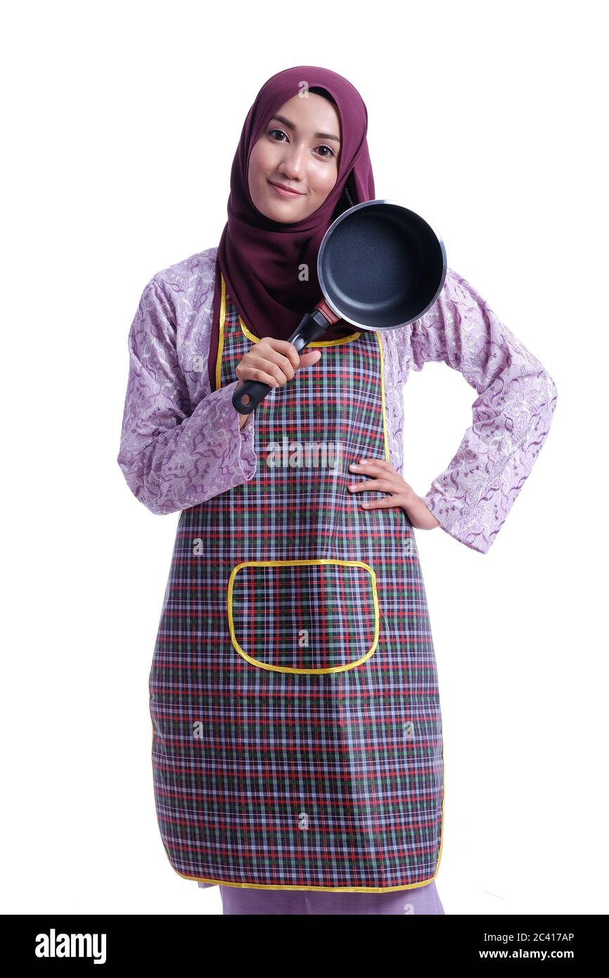 Housewife wearing apron in action Stock Photo - Alamy