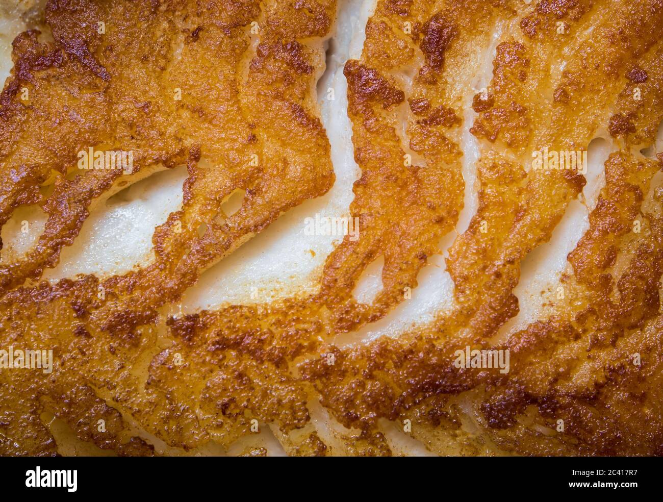 Surface texture pieces of fried white meat of fish Stock Photo - Alamy