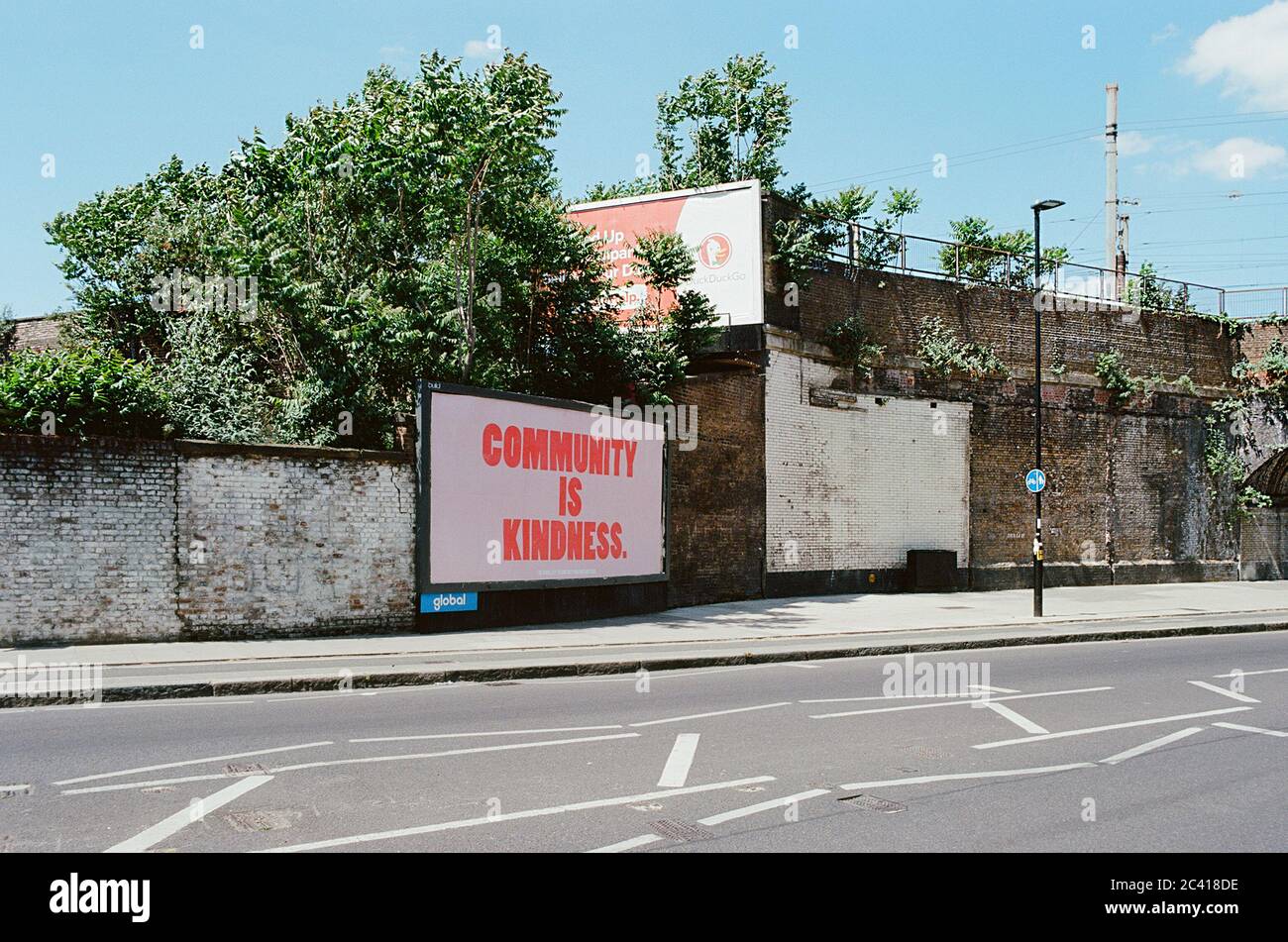 'Community is Kindness' message on a billboard in Arsenal, North London ...