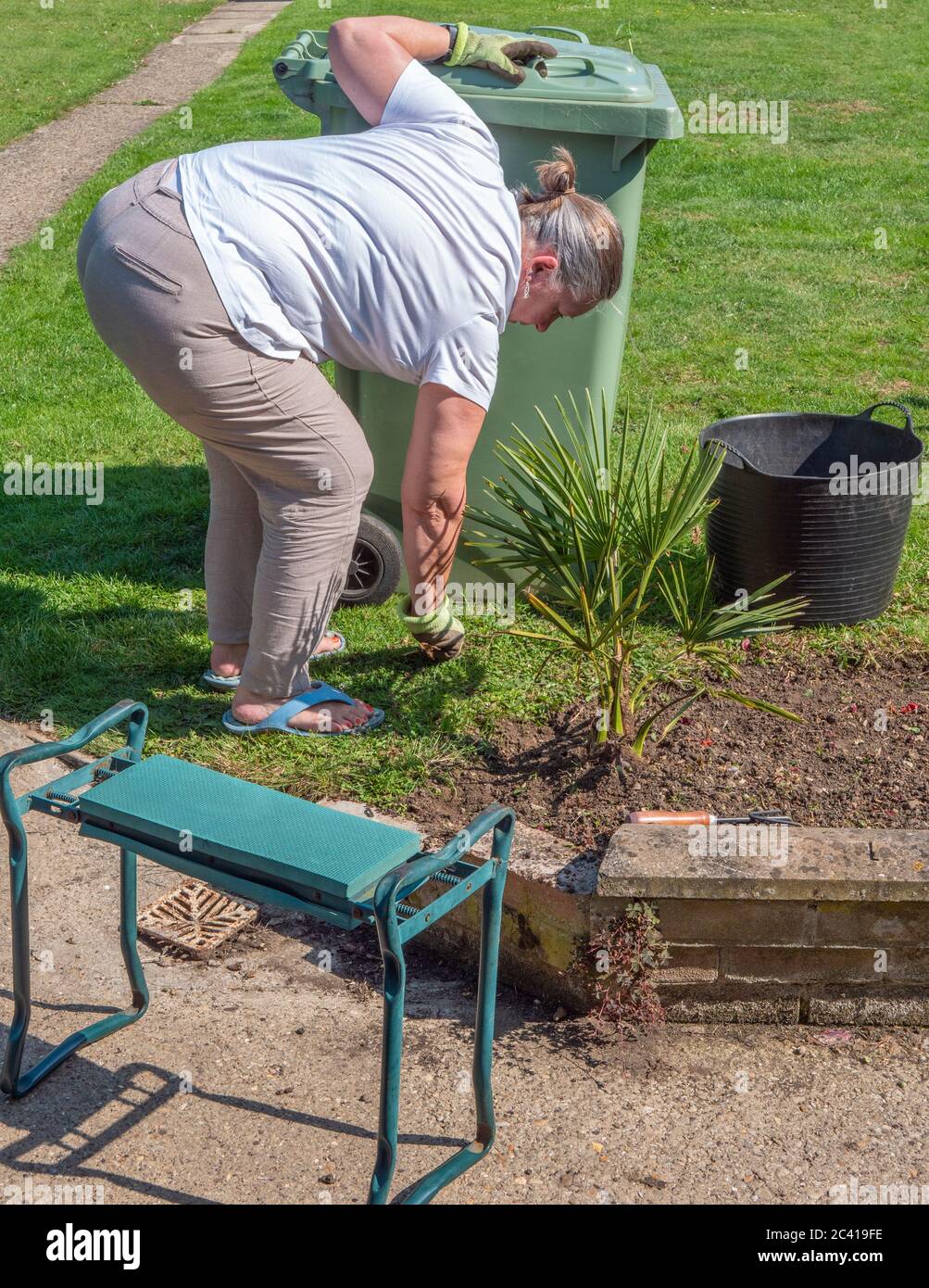Female bending over hi-res stock photography and images - Alamy