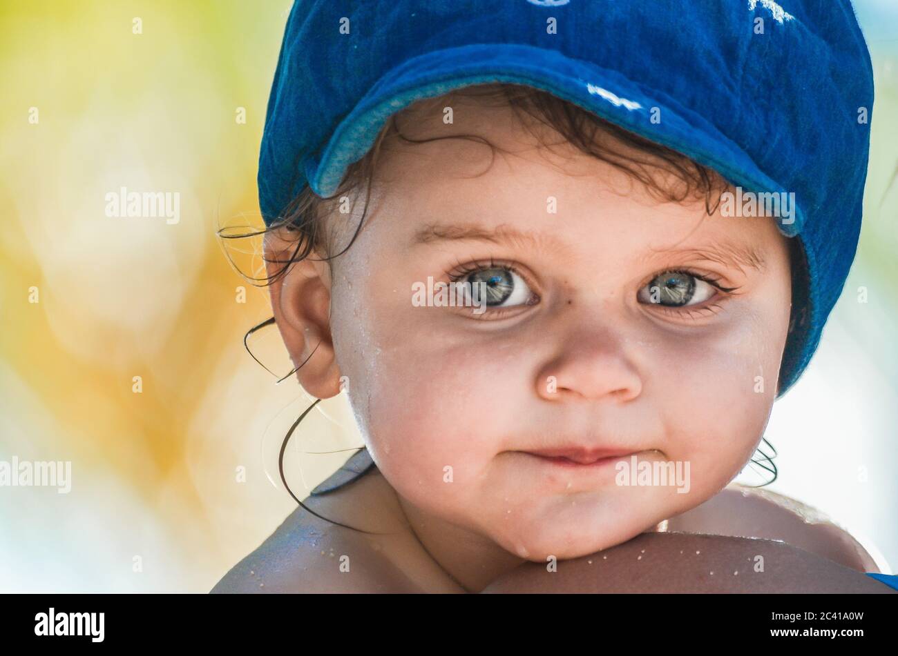Innocent face of a child who looks into the camera smiling Stock Photo ...