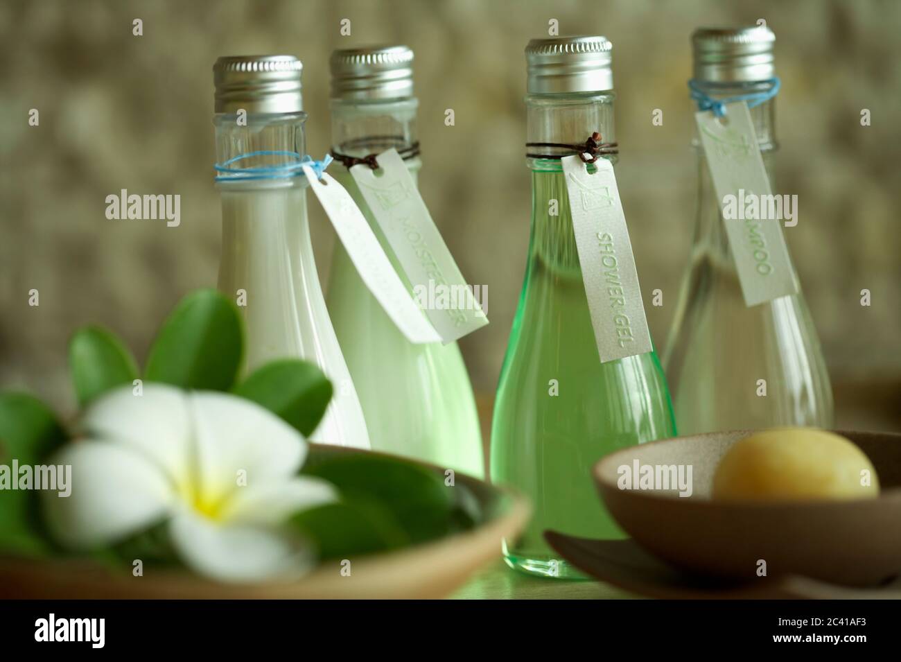Hygiene articles behind flower bowls - wellness - beauty Stock Photo ...