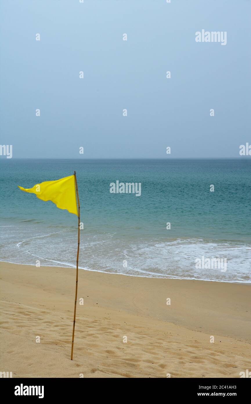 Yellow wind vane on the beach - storm Stock Photo - Alamy