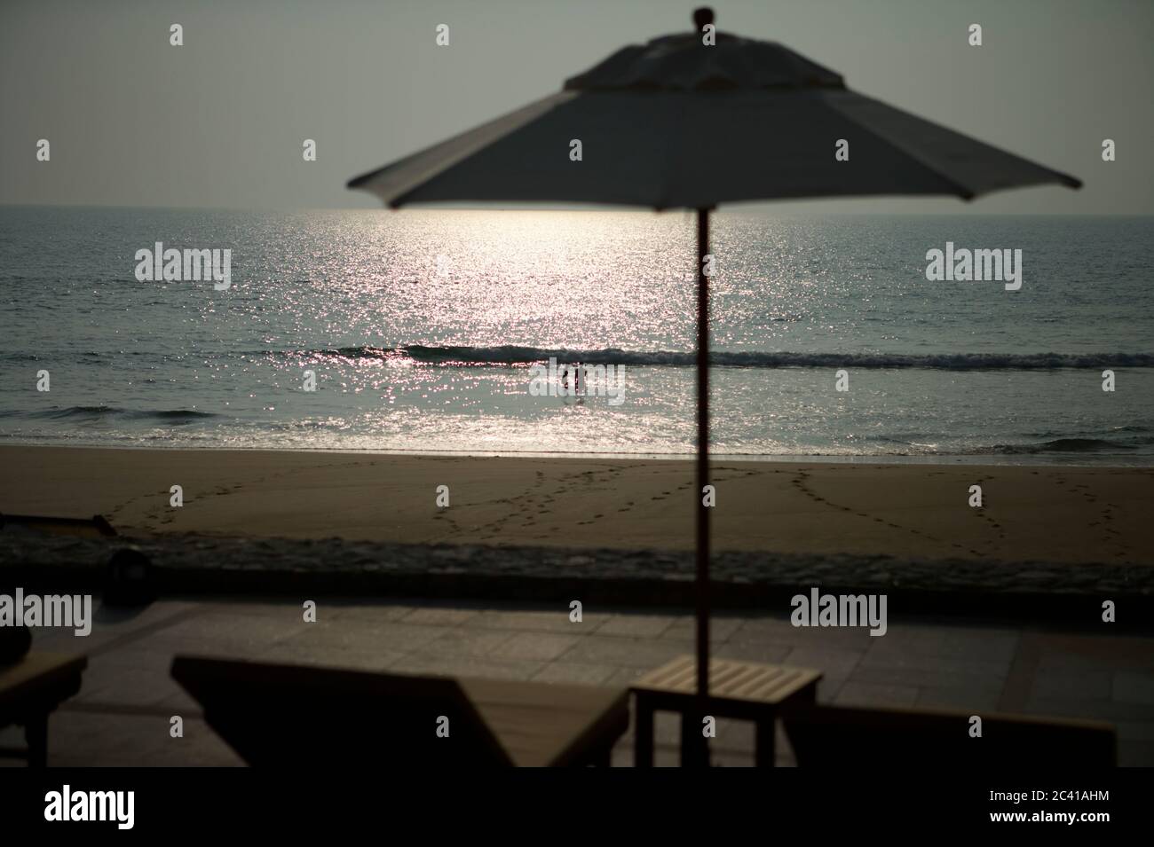 Two people bathe in the sea behind an umbrella - paradise - vacation ...