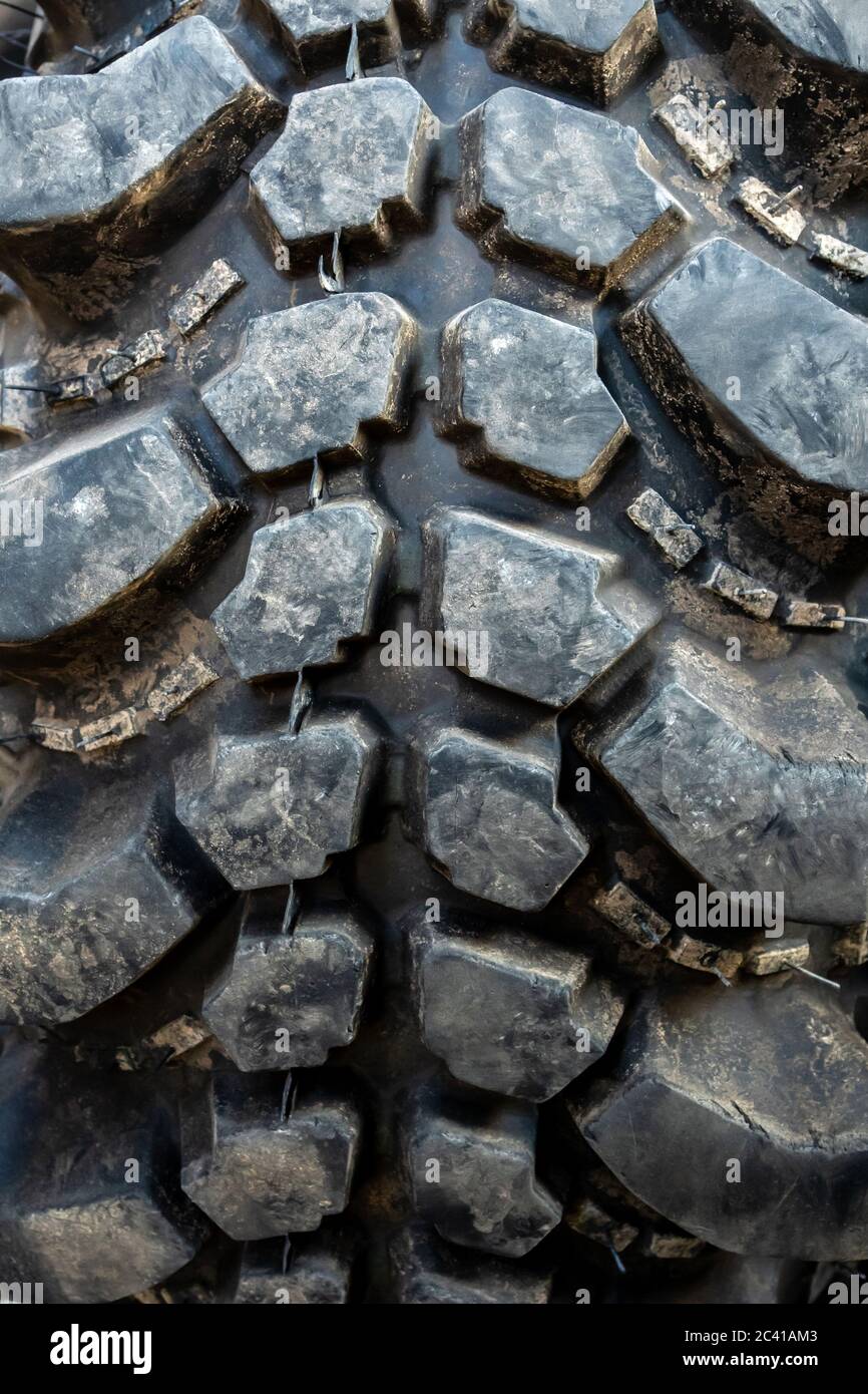 The texture of Centipede pattern mud terrain tire, Old used tires Stock ...