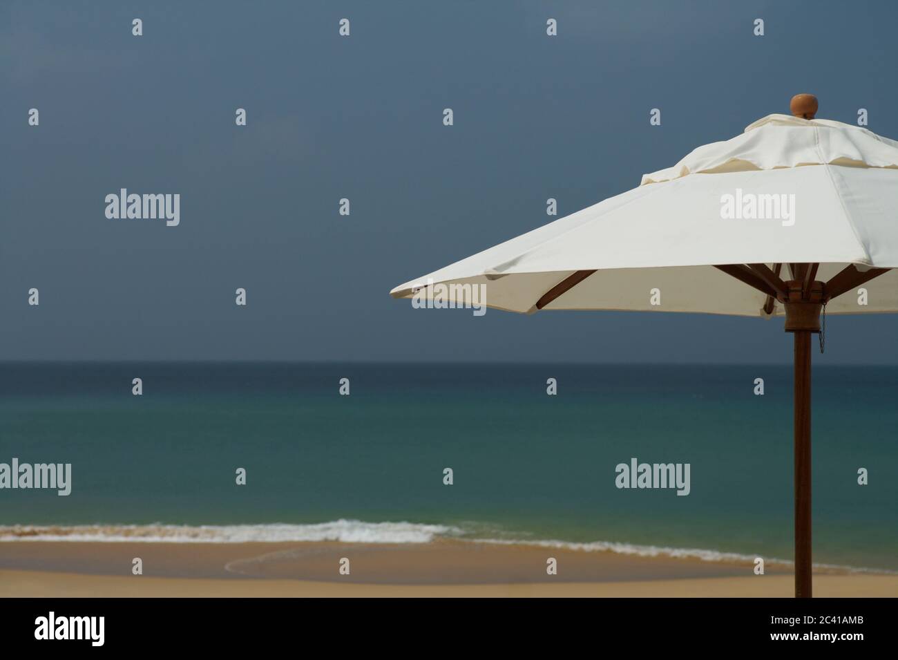 Parasol on the beach - paradise - vacation Stock Photo - Alamy