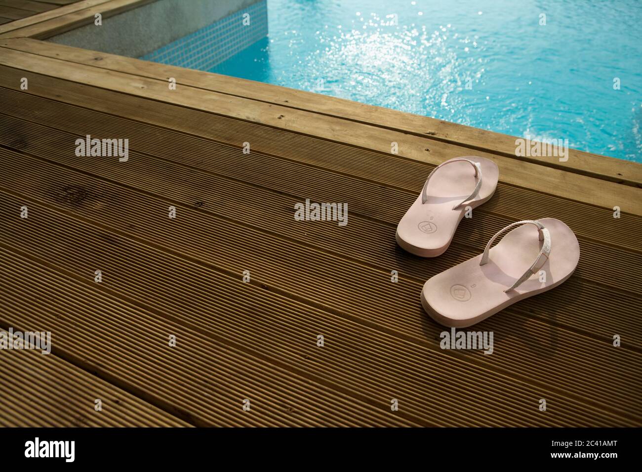 Flip flops by the pool - wellness Stock Photo - Alamy