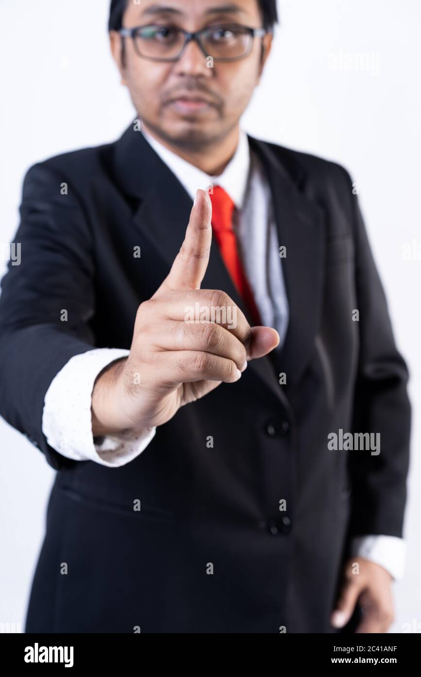 Closed up shot of a man in suit showing "NO" sign, seamless white ...