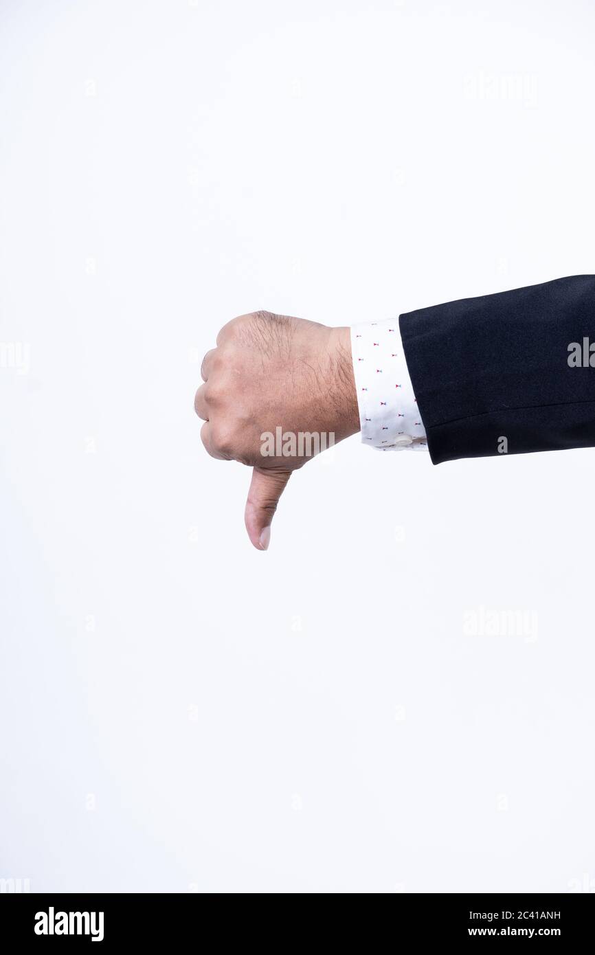 Closed up shot of a man in suit showing "NO" sign, seamless white ...