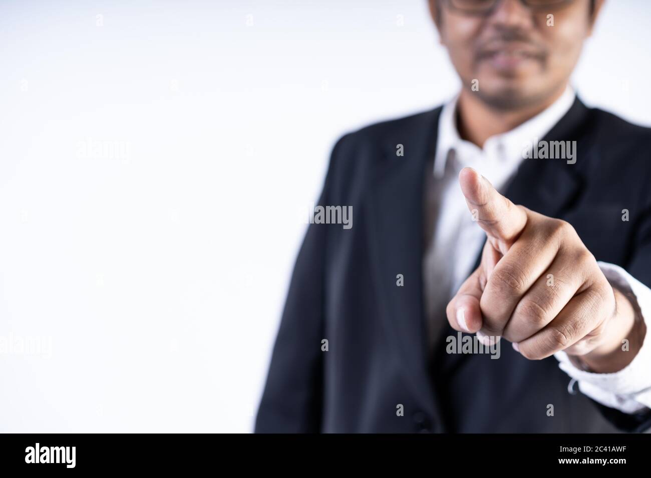 Isolated Closed up shot of an asian men pointing at the camera wearing ...
