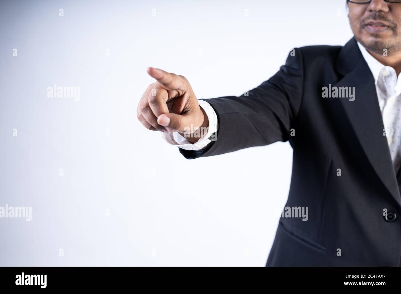 Isolated Closed up shot of an asian men pointing at the camera wearing ...