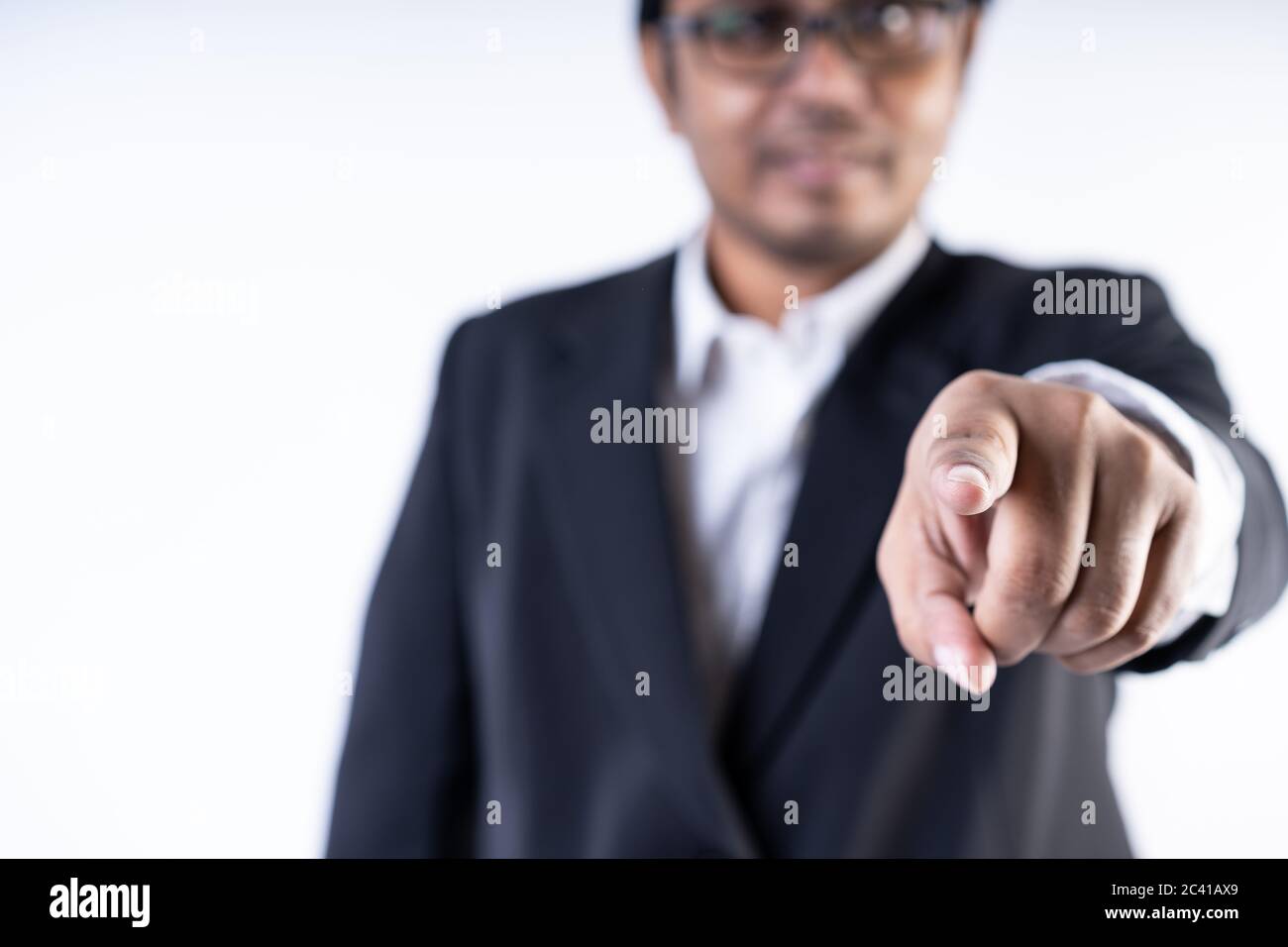 Isolated Closed up shot of an asian men pointing at the camera wearing ...