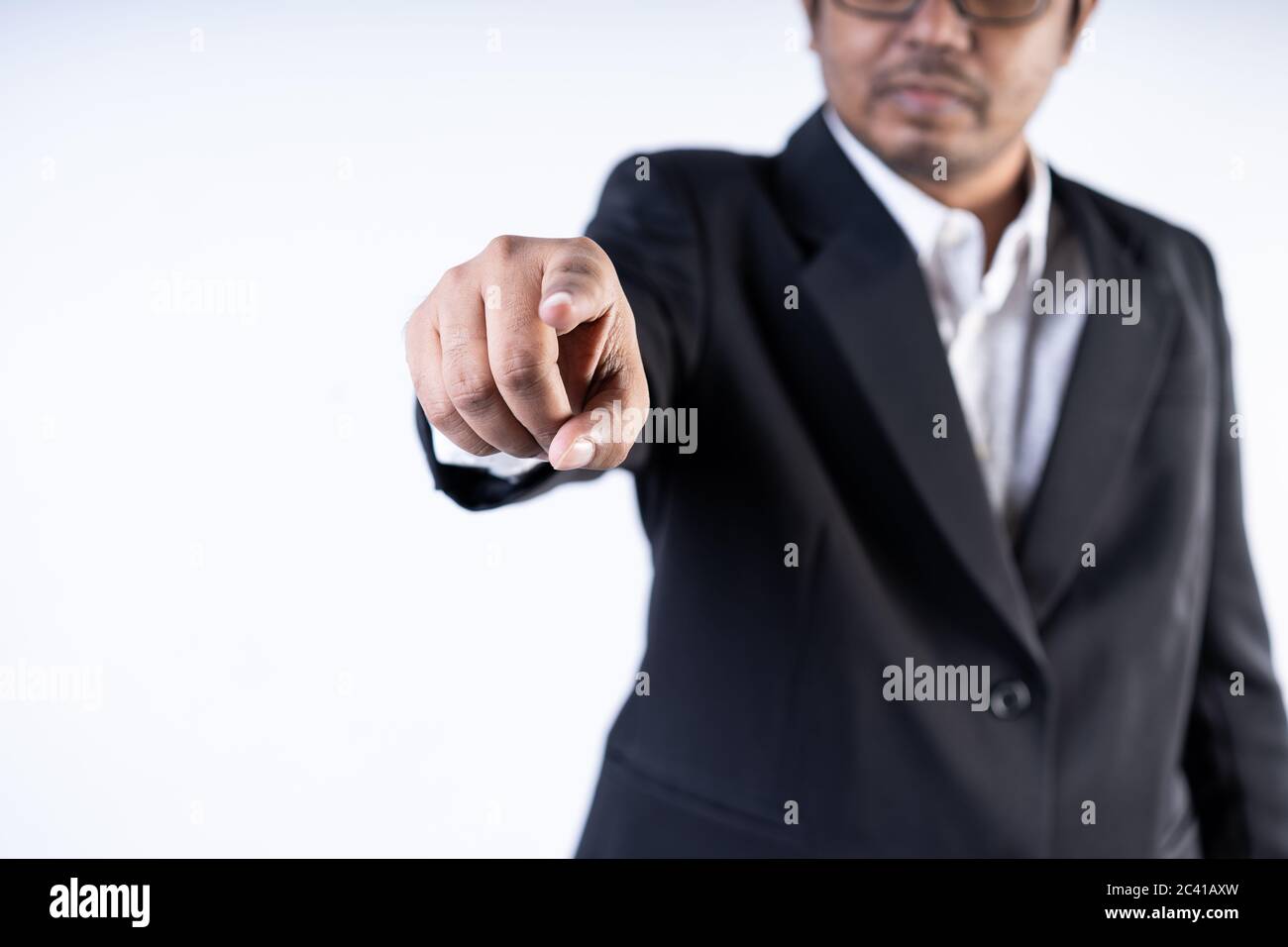 Isolated Closed up shot of an asian men pointing at the camera wearing ...