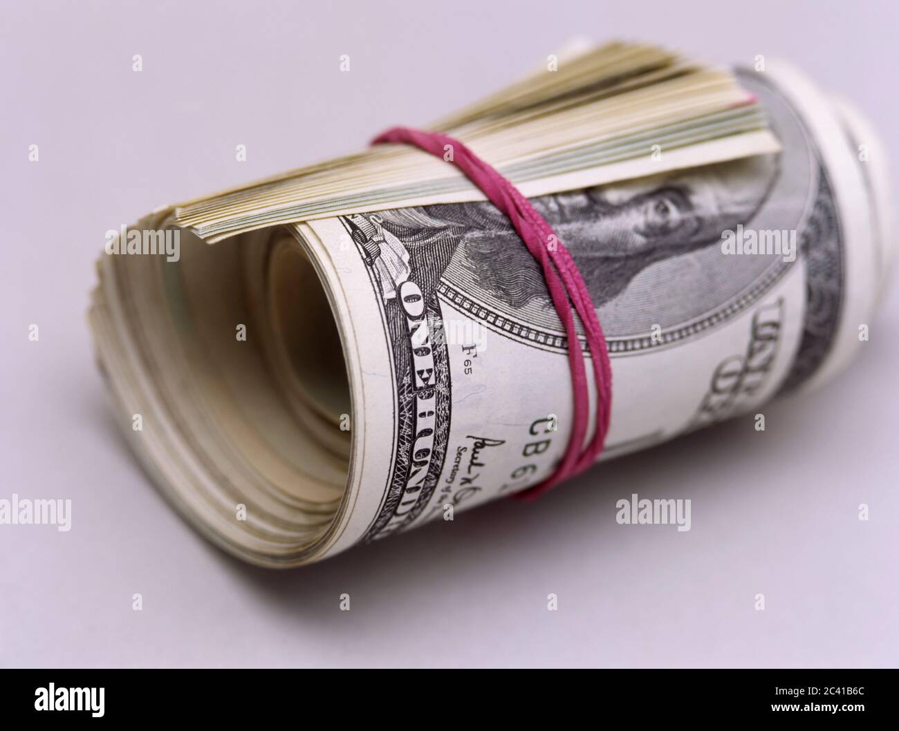 Money roll with dollar bills Stock Photo - Alamy