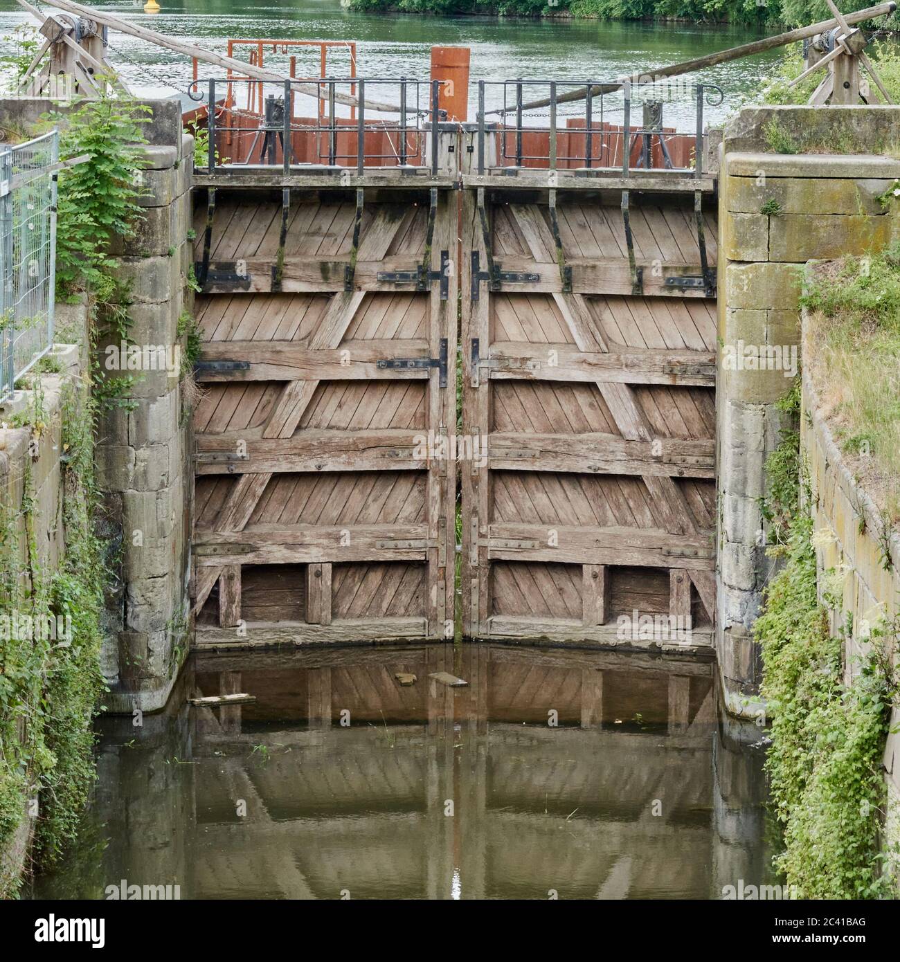 Historical lock with a wooden lock gate Stock Photo - Alamy