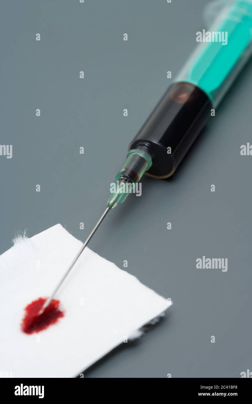 Syringe with blood Stock Photo - Alamy