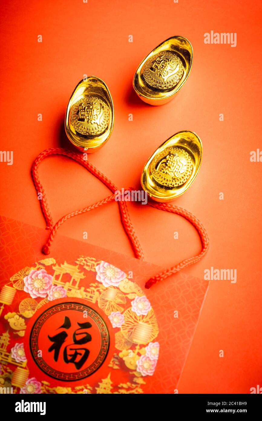 Chinese New Year background. The wordings on gold bar is chinese words ...