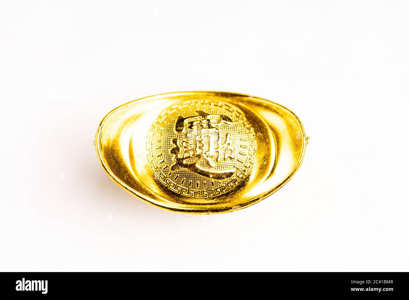 Chinese Gold Bar isolated against white. The words on the gold bar is ...