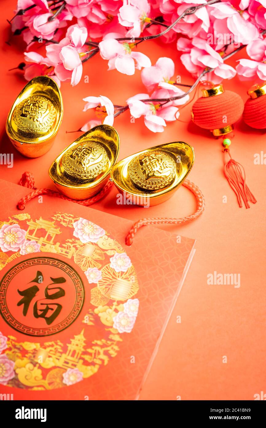 Chinese New Year background. The wordings on gold bar is chinese words ...