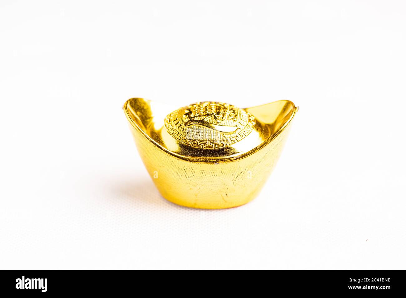 Chinese Gold Bar isolated against white. The words on the gold bar is ...