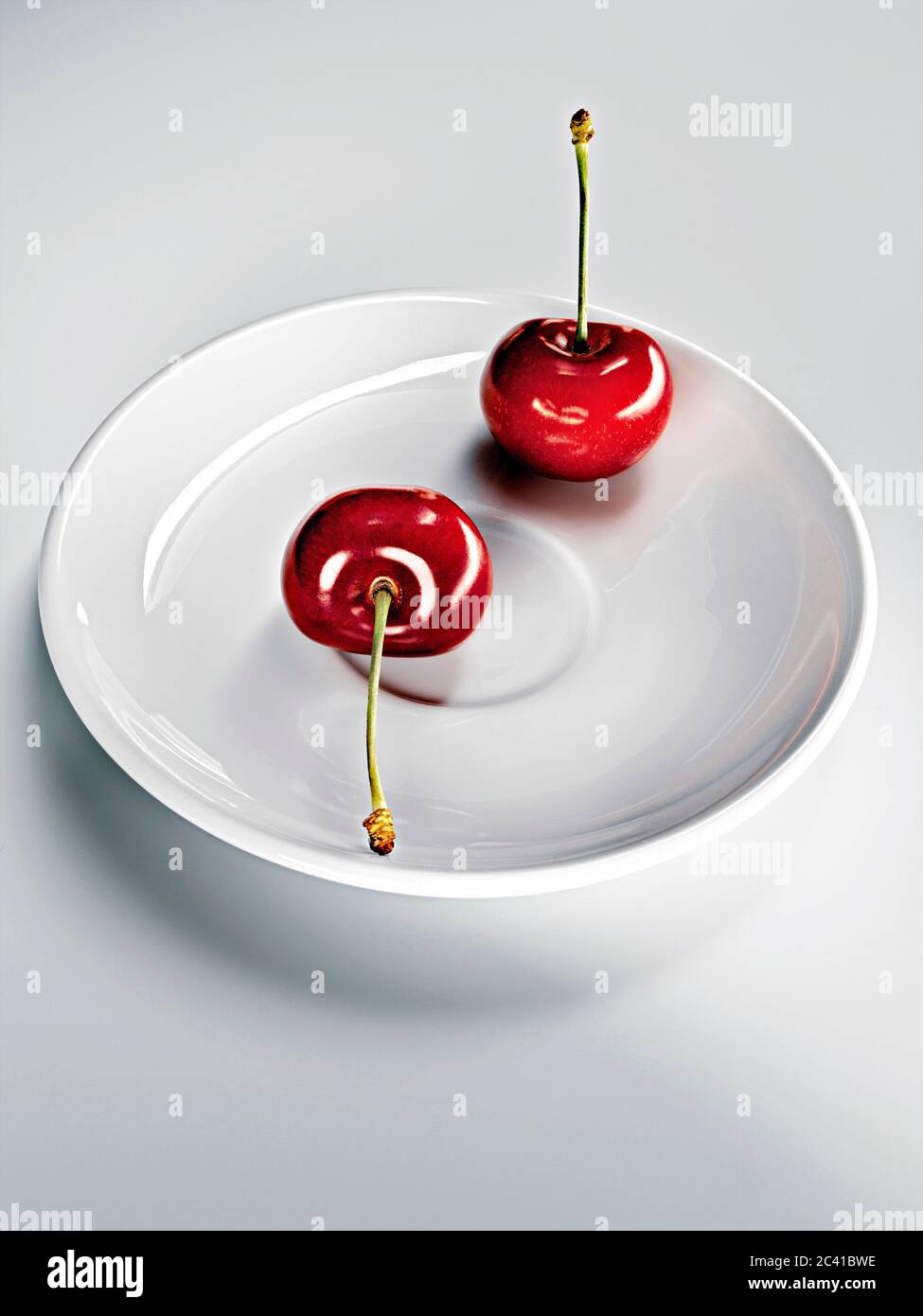 Two shiny red cherries in a bowl - fruit - poison - seduction Stock ...