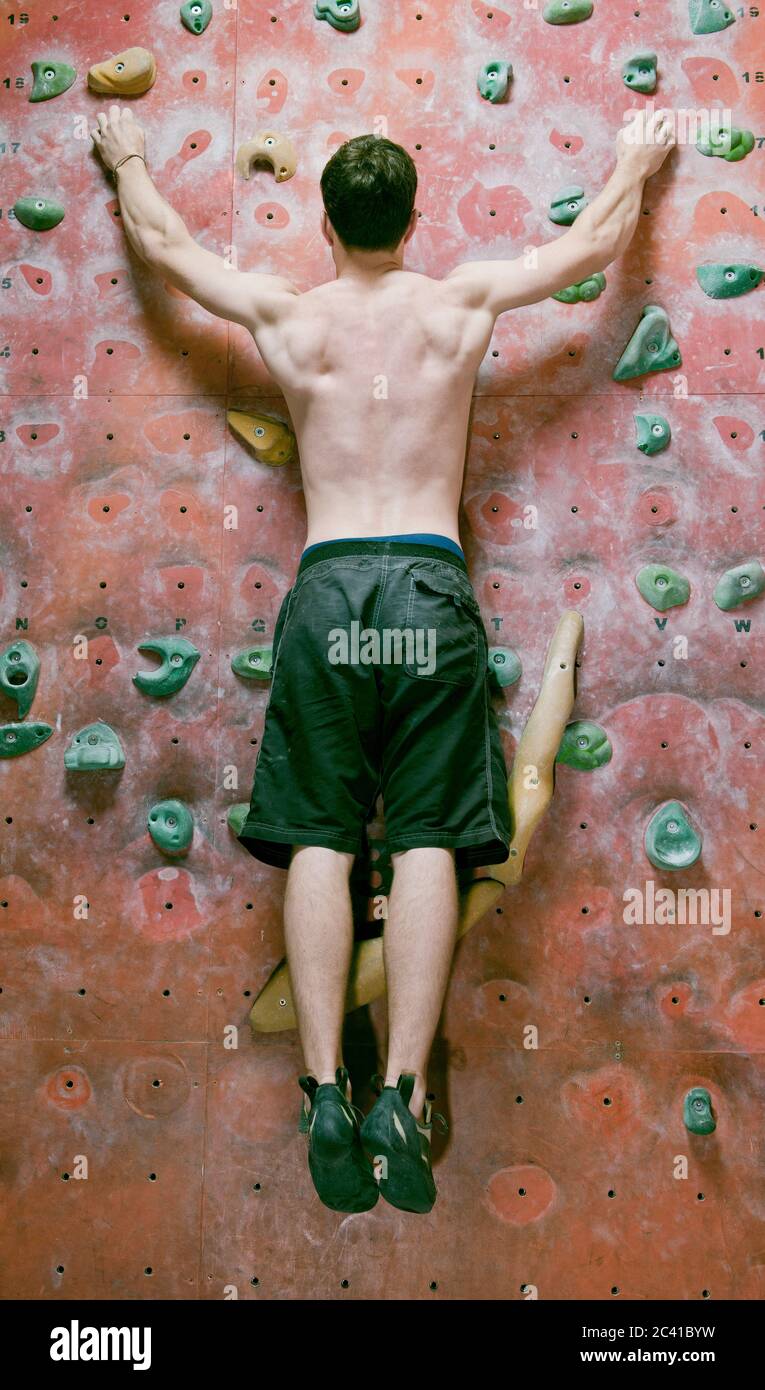 man bouldering at indoor gym in England Stock Photo - Alamy