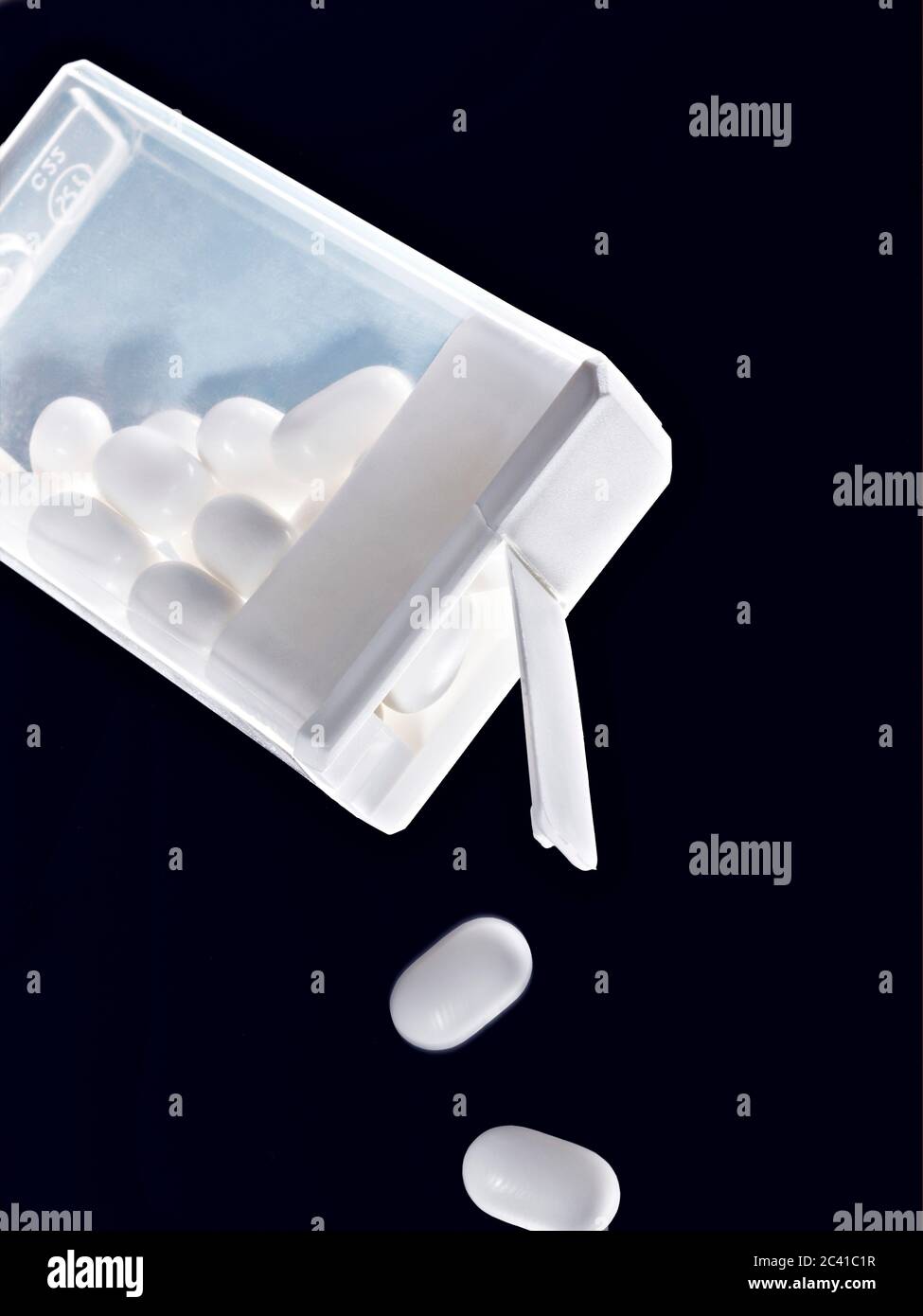 Pastilles fall out of their plastic containers - refreshment candies ...