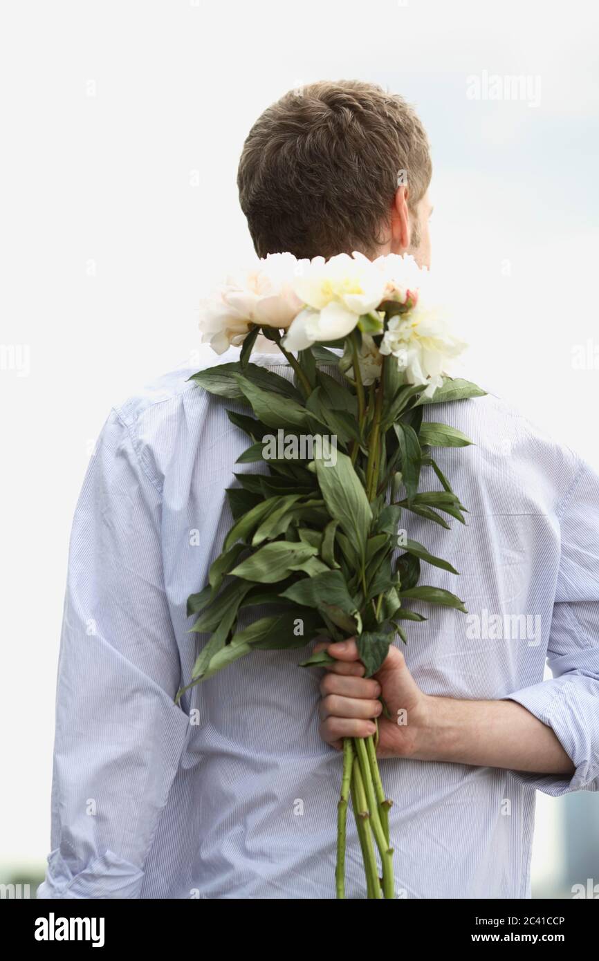 Flowers outside man behind hi-res stock photography and images - Alamy
